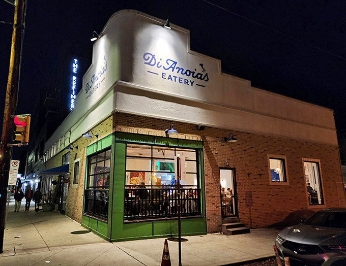 DiAnoia's Eatery glows like a beacon at night, its green-framed corner entrance inviting hungry Pittsburghers into its warm embrace.