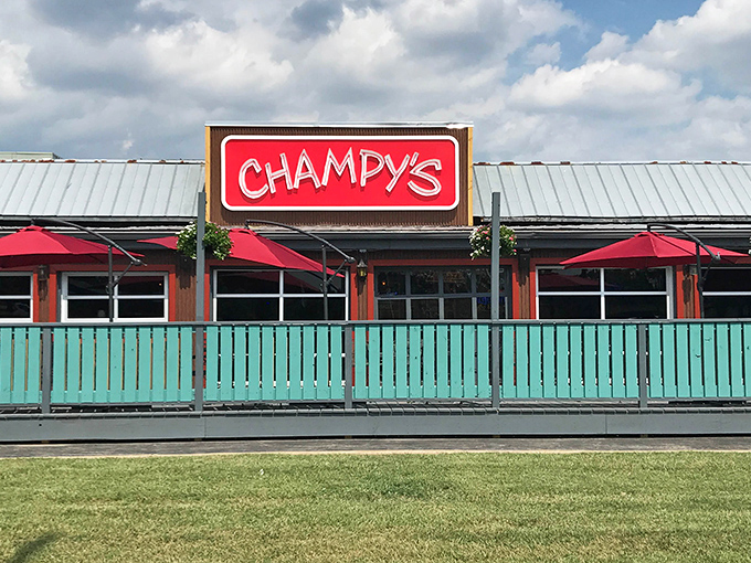 Champy's distinctive turquoise fence and bright red sign create the perfect first impression&mdash;like a colorful welcome mat for your taste buds.