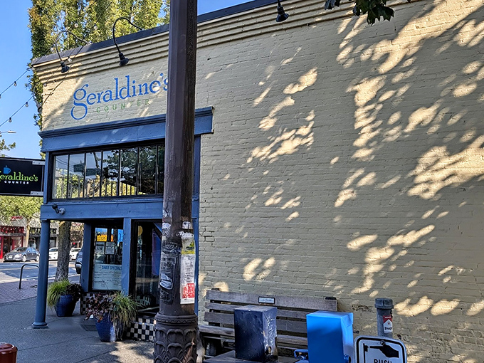 The cream-colored exterior with bright blue trim isn't just inviting&mdash;it's practically waving you in for breakfast bliss at Geraldine's Counter.