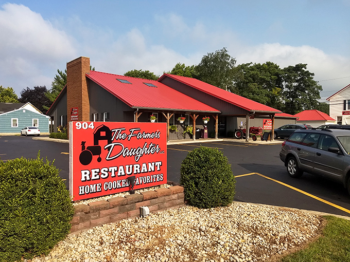 Even before you step inside, the red roof and rustic sign tell you exactly what to expect: comfort, tradition, and the kind of food that keeps you coming back.