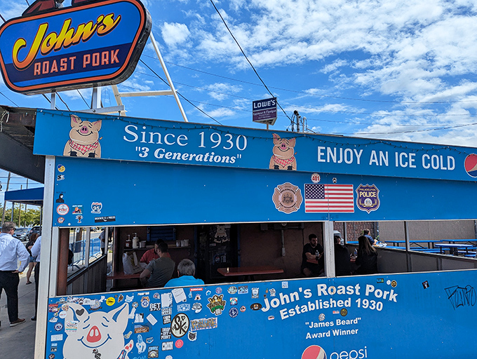 The blue sanctuary of sandwich perfection announces itself with a cheerful pig mascot. John's Roast Pork has been making Philadelphians smile since long before Instagram food pics.
