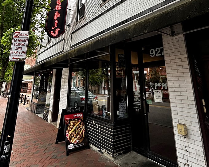 The iconic red Peppi's sign beckons hungry Pittsburghers like a lighthouse for the famished. This Western Avenue institution promises sandwich salvation just steps away.