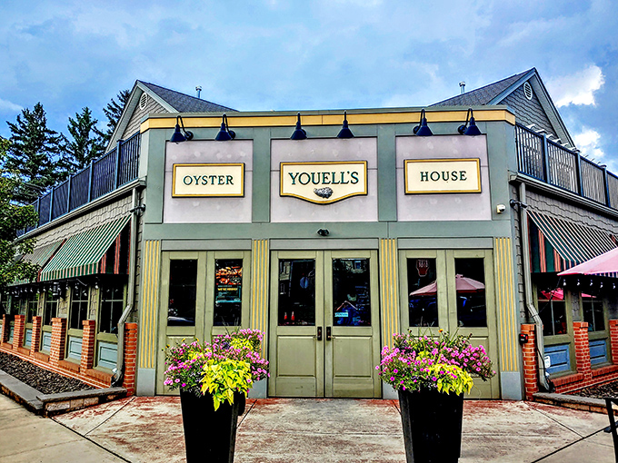 Youell's Oyster House stands like a mint-green beacon of seafood salvation in Allentown, welcoming hungry pilgrims with its classic awnings and vibrant flower displays.