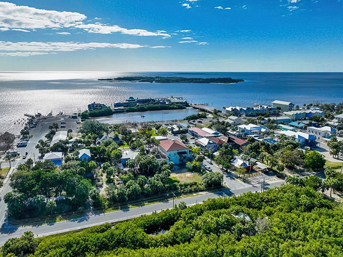 Cedar Key's aerial view reveals nature's perfect balancing act &ndash; turquoise waters meeting colorful cottages, all basking under that impossibly blue Florida sky.
