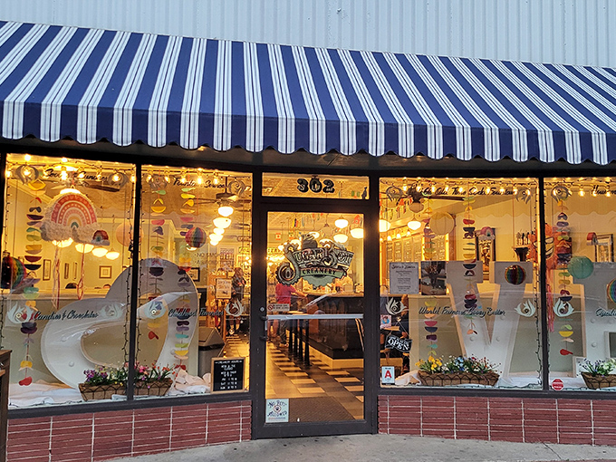 That blue and white striped awning isn't just decoration&mdash;it's a beacon of sweetness calling you into a world where calories don't count and joy is served by the scoop.