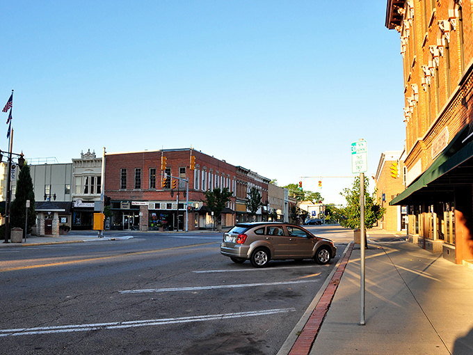 Napoleon's main street captures that perfect small-town America vibe where traffic jams involve waving at too many neighbors while crossing the street.
