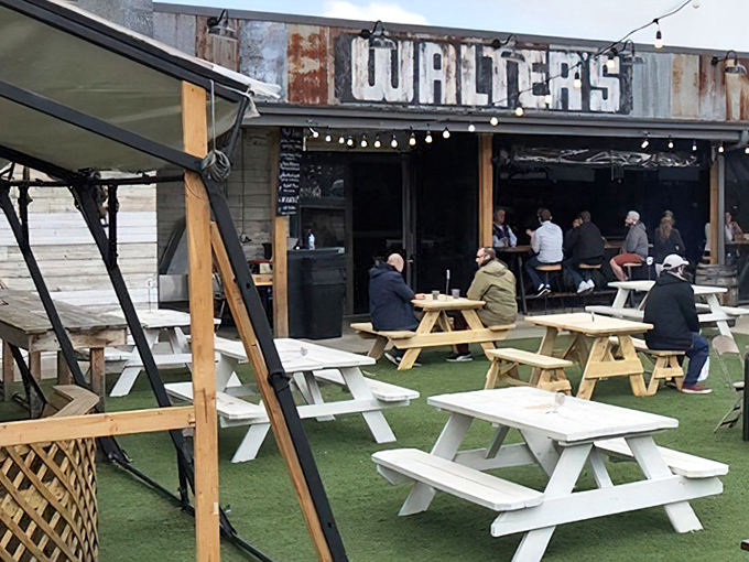 The outdoor dining area at Walter's combines rustic charm with Pittsburgh practicality&mdash;string lights overhead turn ordinary picnic tables into the perfect spot for carnivorous communion.