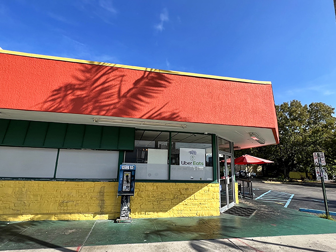 Jimmy's coral-red exterior stands like a beacon of breakfast hope on Biscayne Boulevard, where luxury cars and pickup trucks share parking spaces in democratic hunger.