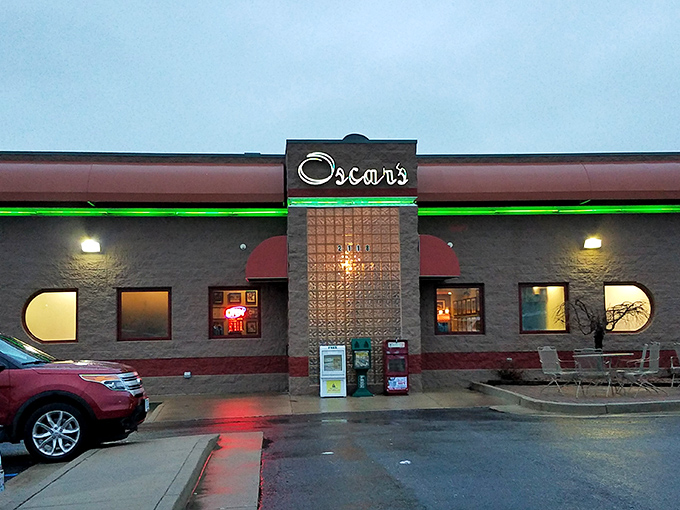 Oscar's welcoming exterior glows with promise as dusk settles, the neon sign beckoning hungry travelers like a lighthouse for breakfast enthusiasts.