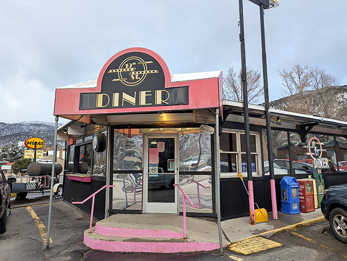 The iconic pink-trimmed entrance of 19th Street Diner stands like a beacon of breakfast hope against the New Mexico mountains. Retro never tasted so good.