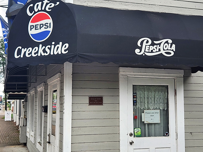 The iconic black awning with its vintage Pepsi logo stands as a time portal to when diners were the beating heart of American communities.