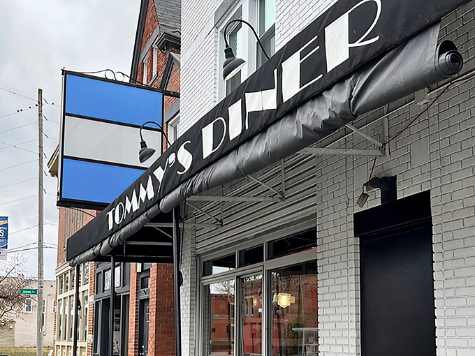 That iconic blue and black sign isn't just announcing a diner&mdash;it's promising a time machine to when calories were just numbers and comfort was king.