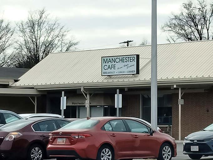 The unassuming exterior of Manchester Cafe promises no frills, just honest-to-goodness food that keeps the parking lot perpetually full of hungry locals.