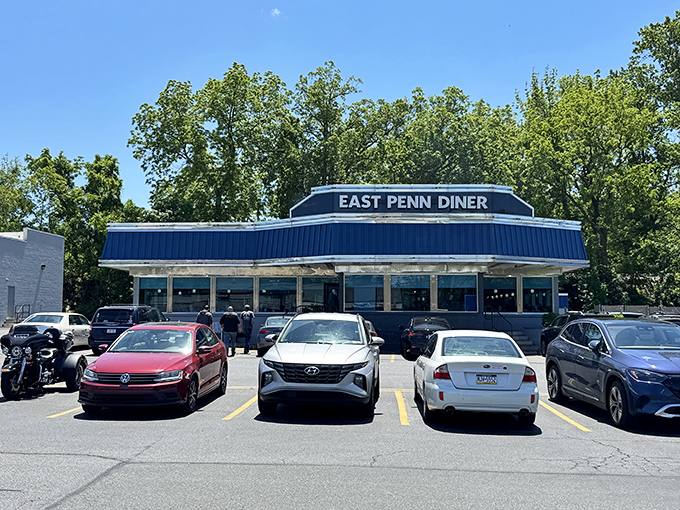 The iconic blue-trimmed exterior of East Penn Diner stands like a beacon of breakfast hope on busy mornings when only pancakes will do.