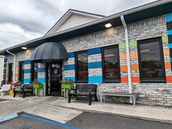 The colorful brick exterior of Early Bird Diner stands out like a cheerful greeting card. Those blue and orange stripes promise something more exciting than your average breakfast joint.