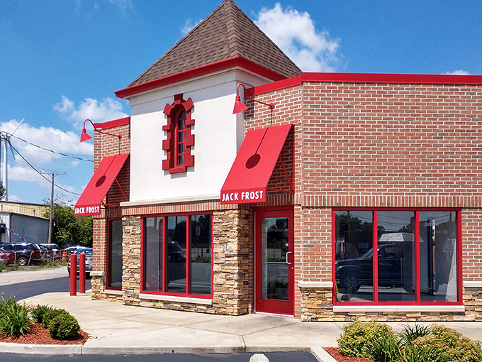 The white building with that bold red sign promises something magical inside. Like a donut beacon calling you home.