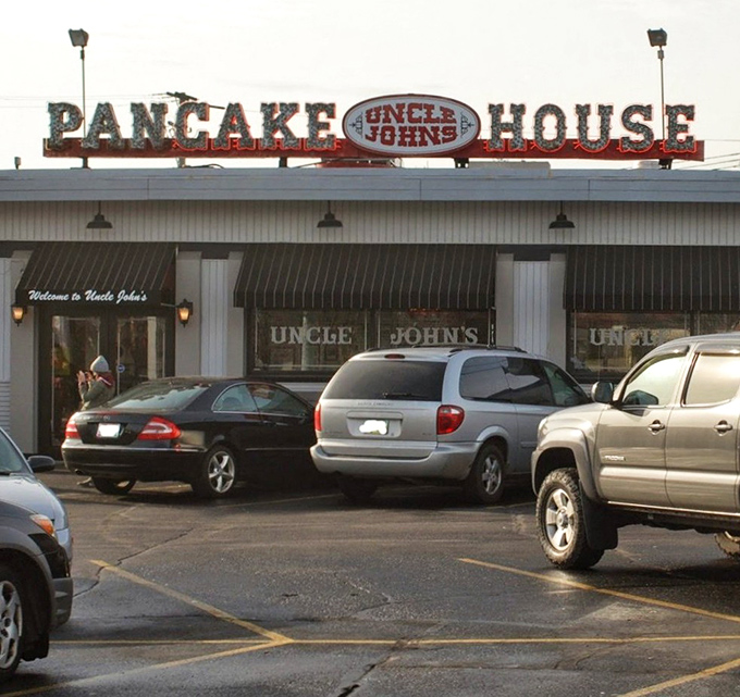 The weathered sign of Uncle John's stands like a beacon for breakfast pilgrims, promising pancake salvation to all who enter this Toledo institution.