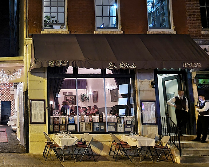 As evening falls, La Viola's warm glow beckons hungry passersby like a lighthouse for pasta-seeking souls.