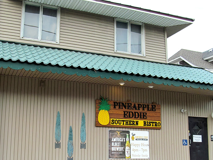 The unassuming exterior of Pineapple Eddie Southern Bistro proves once again that the best culinary treasures often hide behind modest facades. That turquoise awning signals deliciousness ahead!