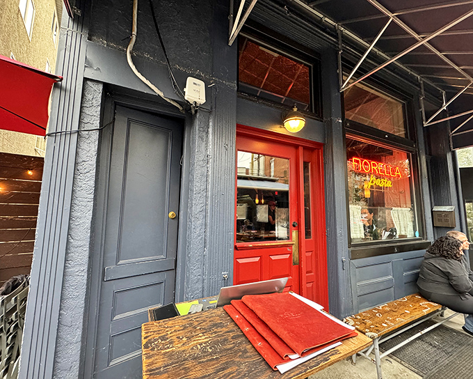 The glowing neon sign beckons like a lighthouse for pasta pilgrims. Fiorella's entrance promises treasures that Italian grandmothers would approve of.