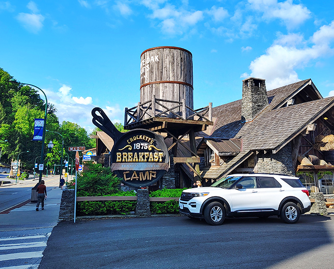 The frontier meets breakfast heaven! Crockett's iconic water tower and rustic log cabin exterior stand ready to transport hungry visitors back to Tennessee's pioneer days.