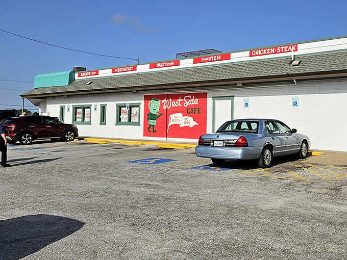 The unassuming exterior of West Side Cafe stands as a beacon of comfort food promise, with its cheerful red signage announcing culinary treasures within.