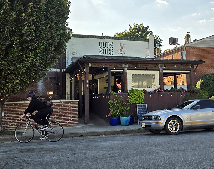 The unassuming exterior of Dot's Back Inn beckons like an old friend, promising comfort food treasures within its brick walls.