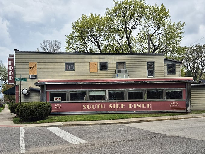 The red-trimmed facade isn't just a building, it's a promise of the Americana experience waiting inside&mdash;complete with outdoor seating for those perfect Indiana summer days.