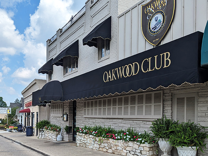 The classic black awning and white brick exterior of Oakwood Club stands as Dayton's beacon for beef lovers. Understated elegance that whispers, "The good stuff is inside."