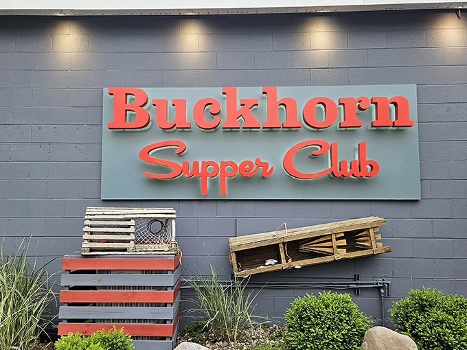 The iconic red signage of Buckhorn Supper Club stands out against the gray exterior, with lobster traps hinting at the treasures waiting inside.