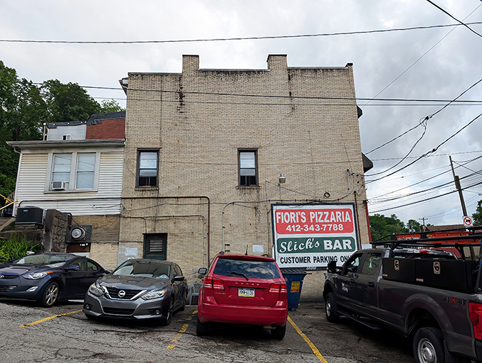 The plain brick walls of Fiori&rsquo;s Pizzaria may not dazzle the eye, but behind them waits a Pittsburgh legend that&rsquo;s been winning hearts one slice at a time.