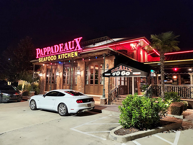 The grand entrance to Pappadeaux beckons with its brick façade and tropical greenery—like a Louisiana manor that wandered north and decided to stay.