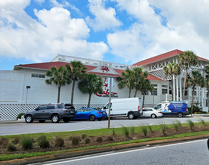 Palm trees frame this coastal landmark where flip-flops are the dress code and seafood arrives so fresh it practically introduces itself.