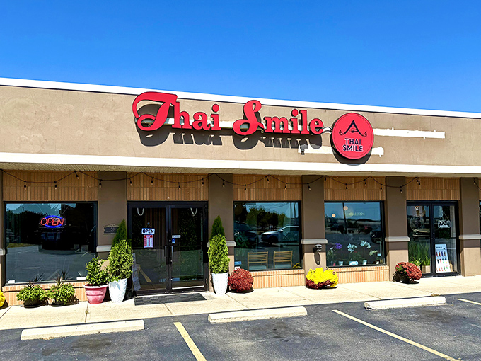 The bright red "Thai Smile" sign beckons like a culinary lighthouse in this unassuming strip mall. Who knew paradise was hiding between a nail salon and a dry cleaner?