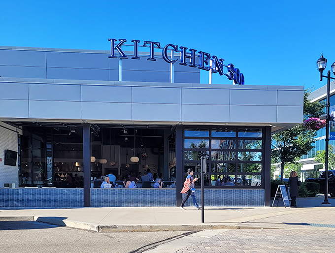 Kitchen Social's sleek exterior promises culinary adventures within. The modern brick and glass fa&ccedil;ade in Dublin's Bridge Park is like a well-dressed friend who always knows the best spots.