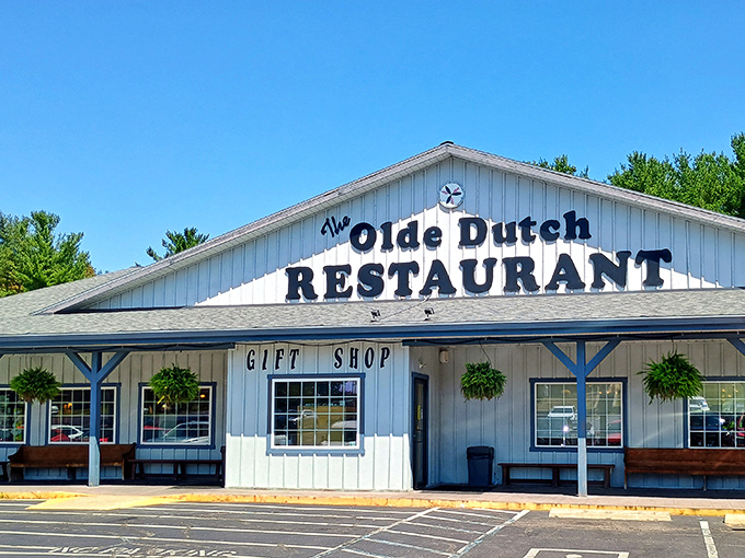 The blue-trimmed white clapboard exterior of Olde Dutch Restaurant stands like a beacon of comfort food promise against Ohio's big sky.