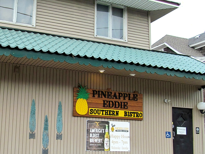 The teal-roofed treasure with its wooden pineapple sign beckons like a tropical oasis in Erie's urban landscape.