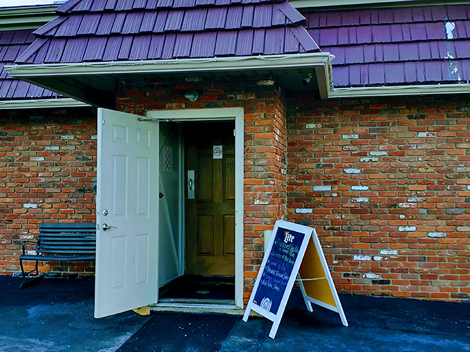 The unassuming entrance to O'Gillies, with its distinctive purple roof, proves once again that culinary treasures often hide behind modest doors.