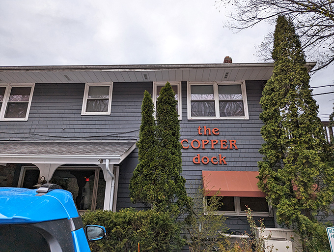 The orange-sided charm of The Copper Dock beckons from Hubertus, promising lakeside comfort that feels like Wisconsin's best-kept secret.