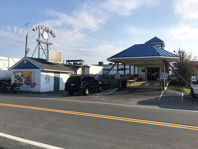 The iconic Captain Billy's sign stands tall against the Maryland sky, like a lighthouse guiding hungry seafood lovers to their destination.