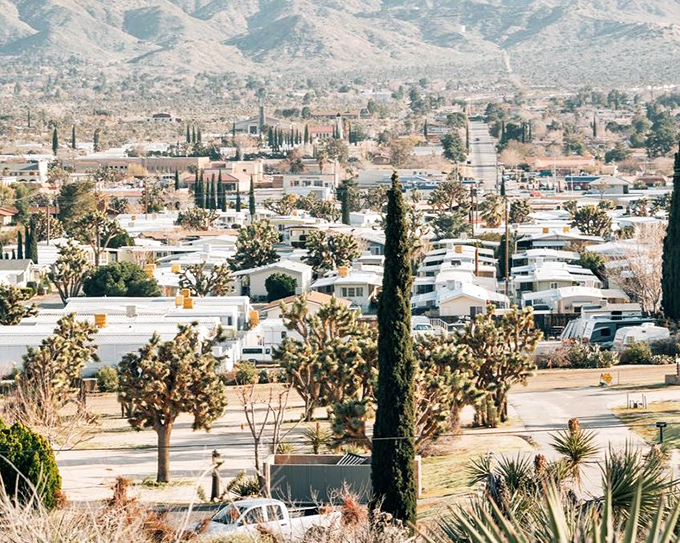 Where desert meets domesticity! Yucca Valley spreads out like a dream, with Joshua trees standing guard over neighborhoods nestled against mountains that change colors like nature's mood ring.