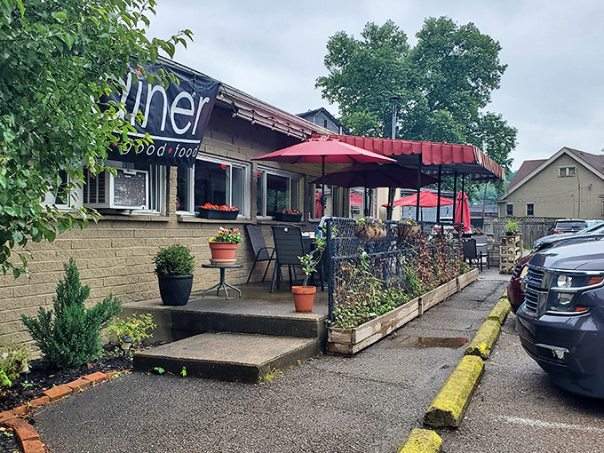 The unassuming exterior of The Diner beckons with its cheerful red umbrellas and lush planters&mdash;proof that culinary treasures often hide in plain sight.