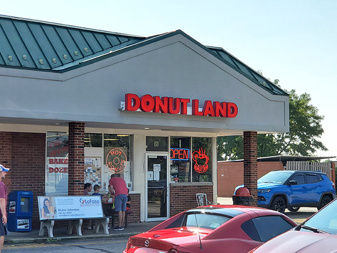 The bright red "DONUT LAND" sign beckons like a lighthouse for the sugar-deprived. Brunswick's sweetest morning destination awaits!