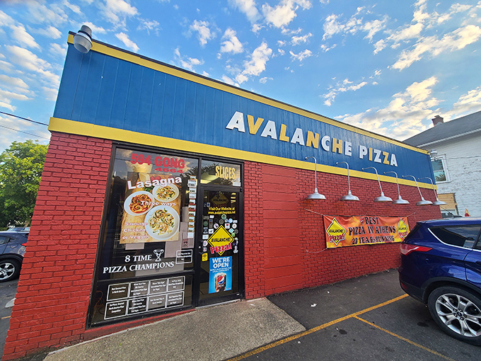 The unmistakable blue and red exterior of Avalanche Pizza stands as Athens' temple to championship-level pizza craftsmanship.