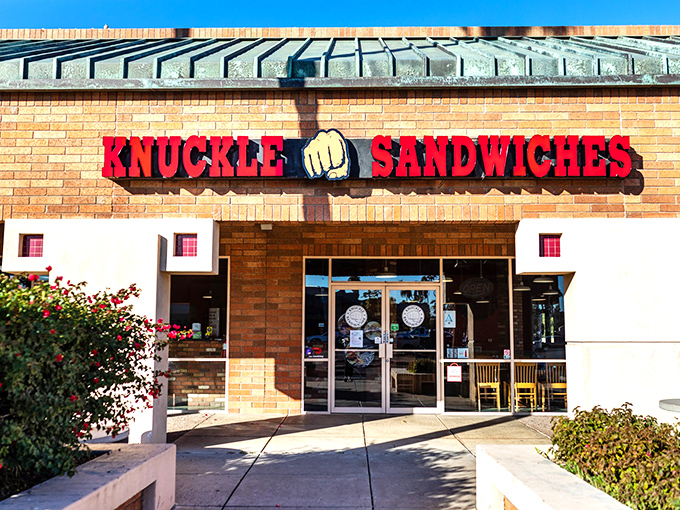 The bold red signage with that iconic fist logo promises a flavor punch that lives up to the name. No fancy frills, just serious sandwich business.