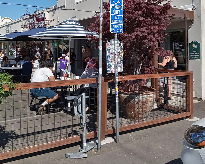 The unassuming exterior of Bacon & Butter belies the breakfast magic happening inside. A wooden patio and striped umbrellas welcome hungry patrons to Sacramento's morning hotspot.