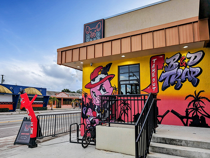 The cartoon pig in a red hat isn't just cute &ndash; it's a beacon of barbecue brilliance. B&D Trap's vibrant exterior promises flavor adventures that the bland beige buildings around it can only dream about.