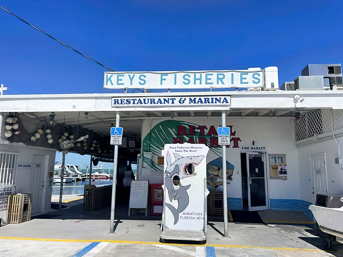 The unassuming entrance to Keys Fisheries stands like a culinary lighthouse, beckoning seafood lovers with promises of ocean-fresh delights in Marathon.