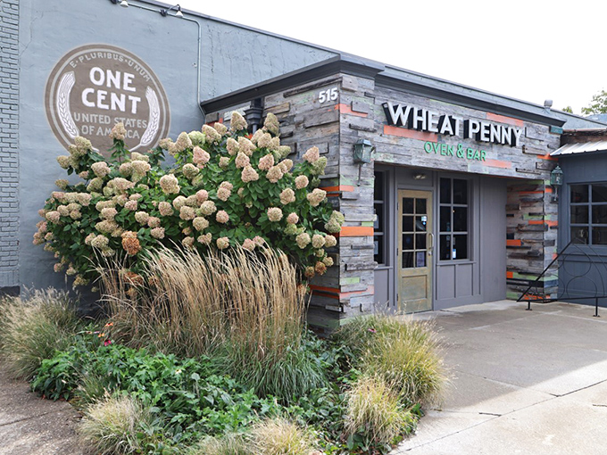 A blue-gray building with a giant penny emblem that screams "worth every cent you'll spend here" before you even taste the legendary eggplant fries.