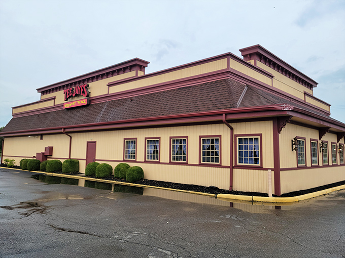 The red sign beckons like a lighthouse for hungry travelers. Tee Jaye's Country Place stands proud against the Ohio sky, promising comfort food salvation inside.